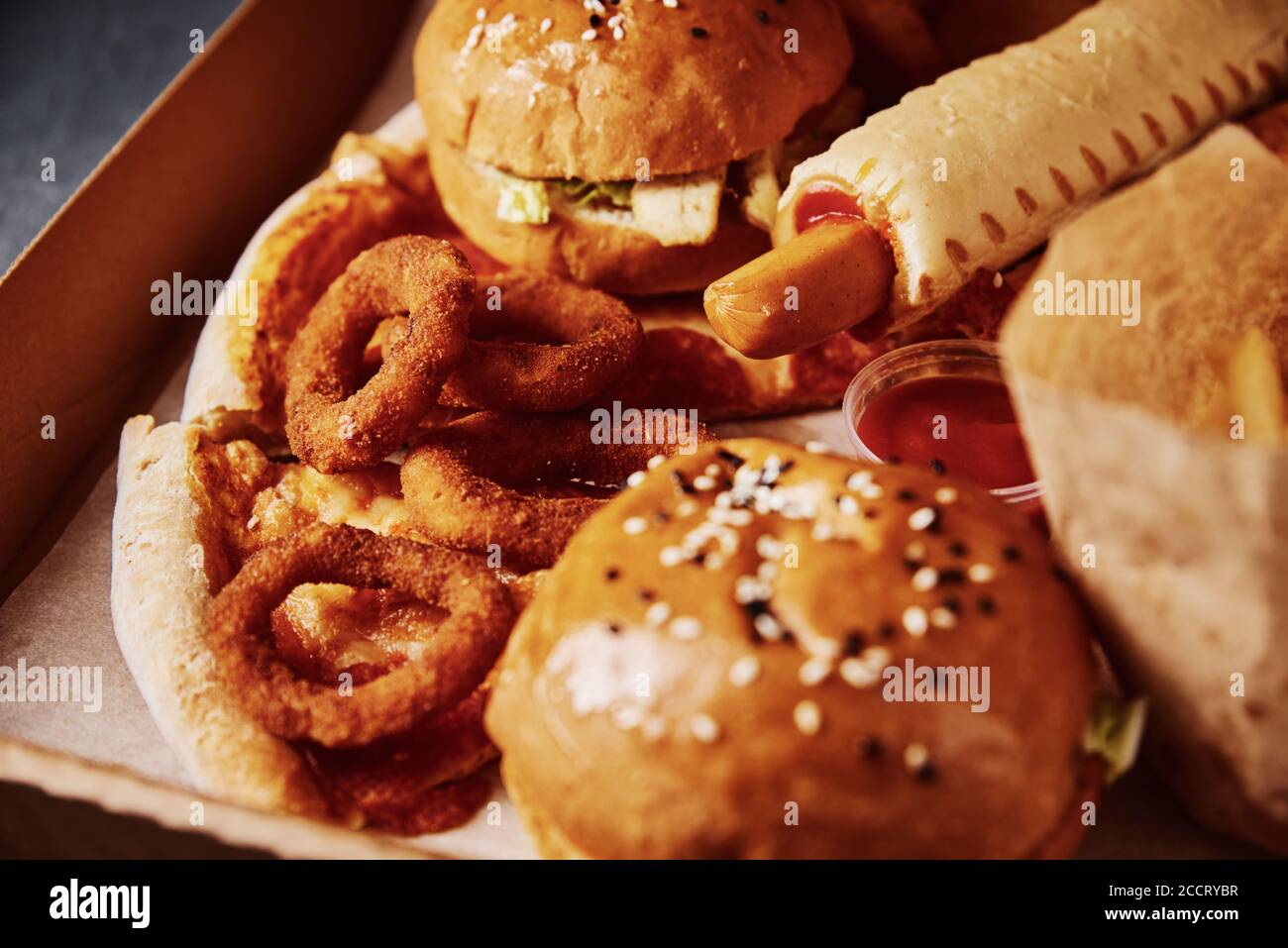 Unhealthy and junk food. Different types of fast food on the table ...