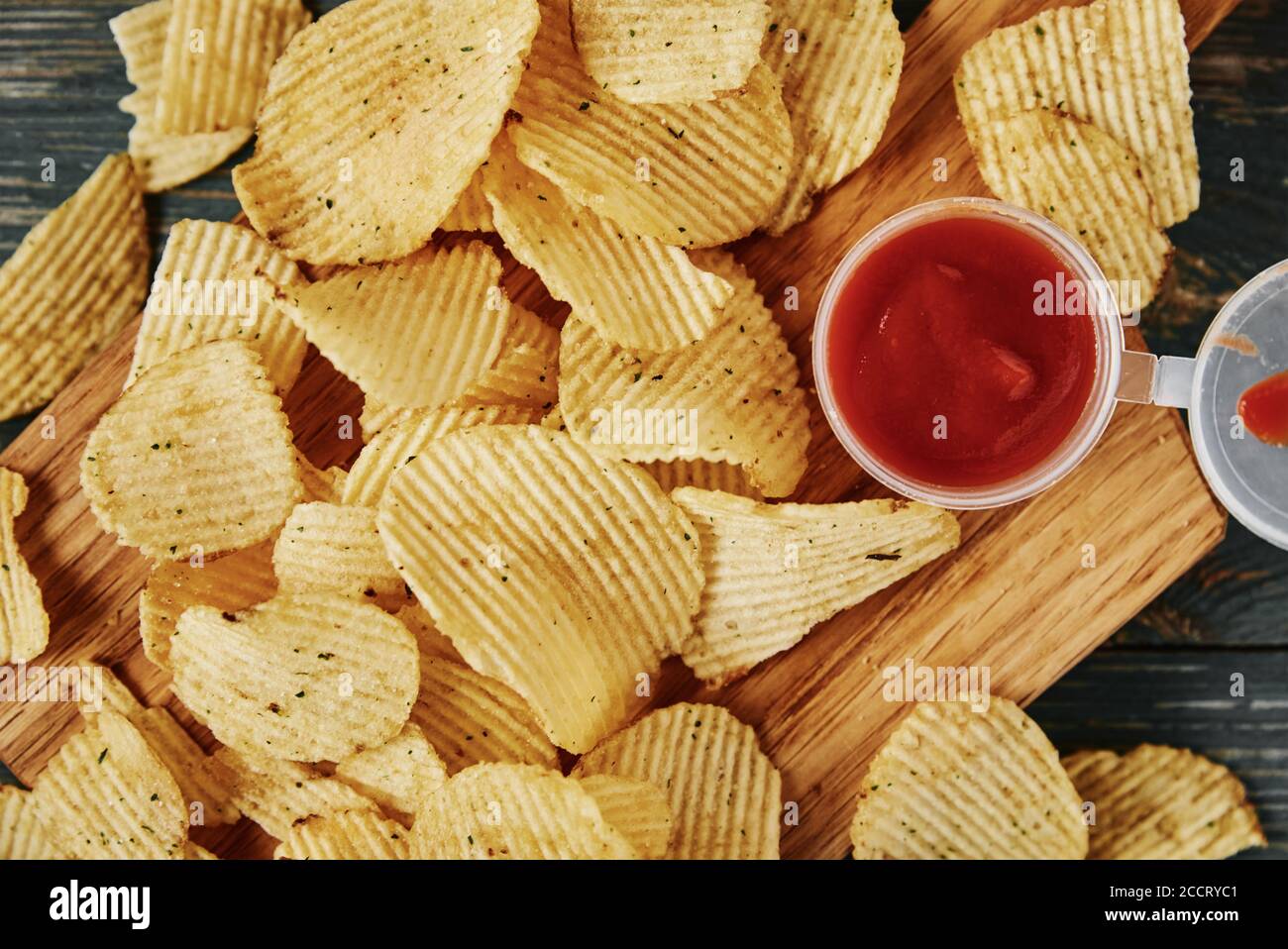 Potato chips and sauce on the table, top view Stock Photo - Alamy