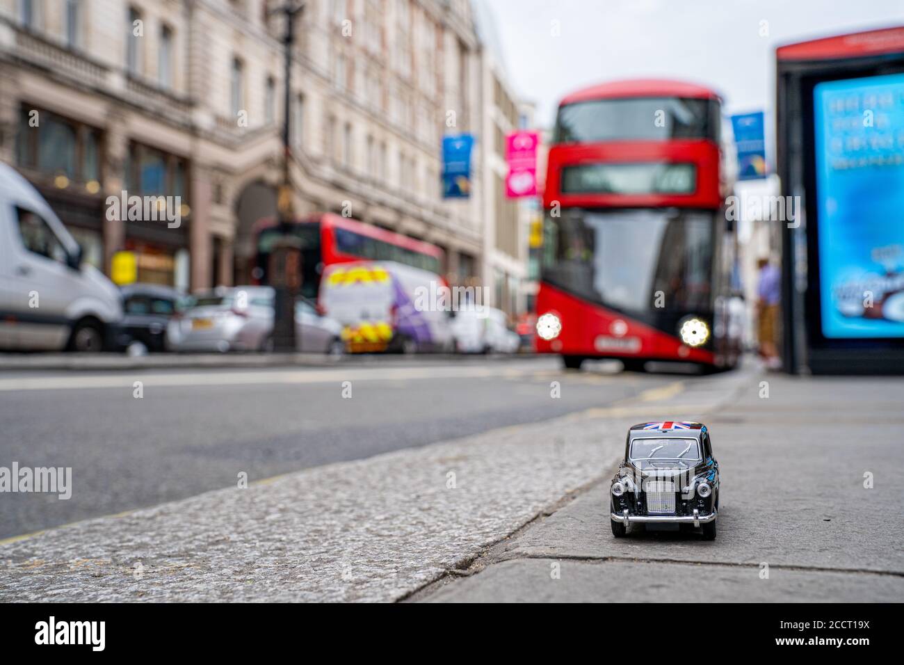 Closeup shot of a traditional black cab driving through the most famous ...
