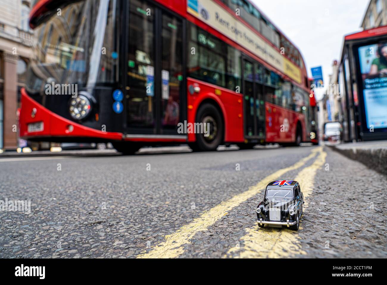 Closeup shot of a traditional black cab driving through the most famous ...