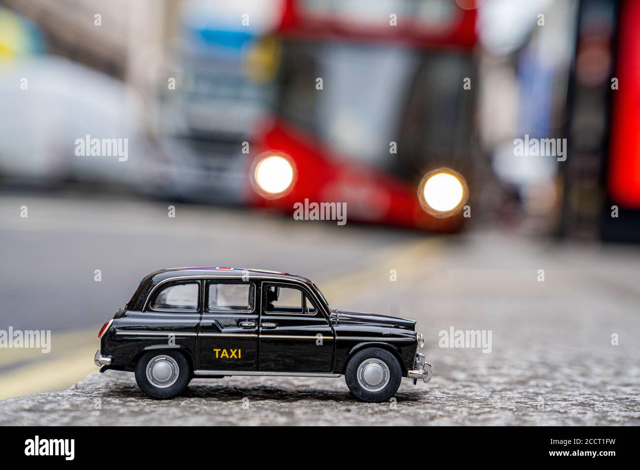 Closeup shot of a traditional black cab driving through the most famous ...