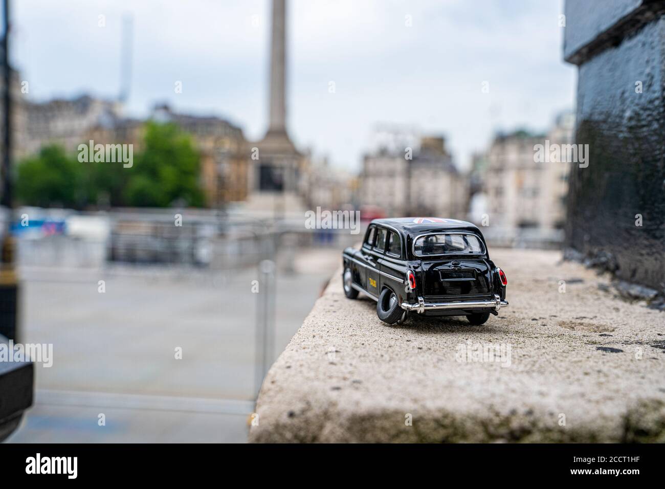 Closeup shot of a traditional black cab driving through the most famous ...