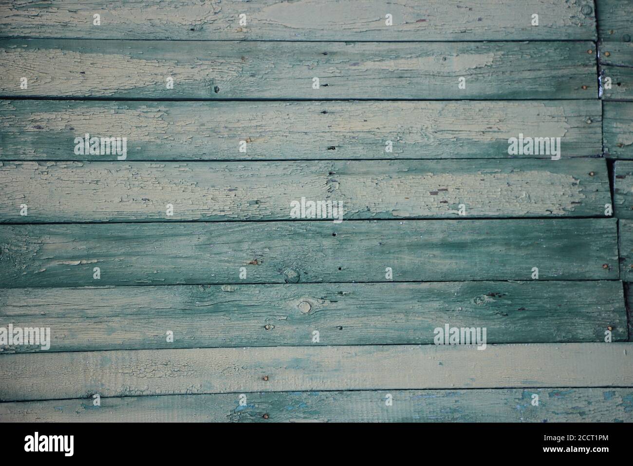 old wooden weathered planks painted into green with horizontal boards ...