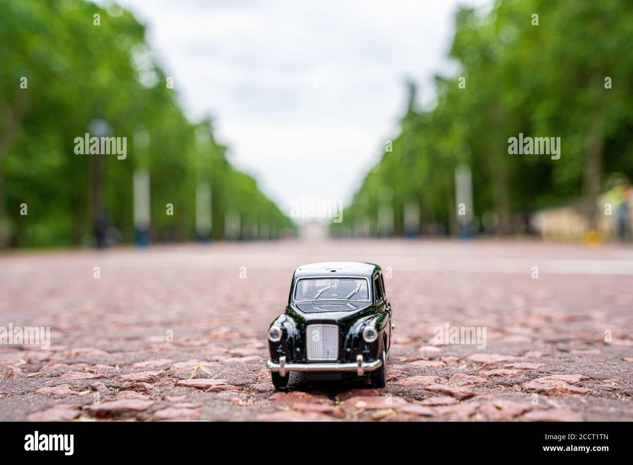 Closeup shot of a traditional black cab driving through the most famous ...