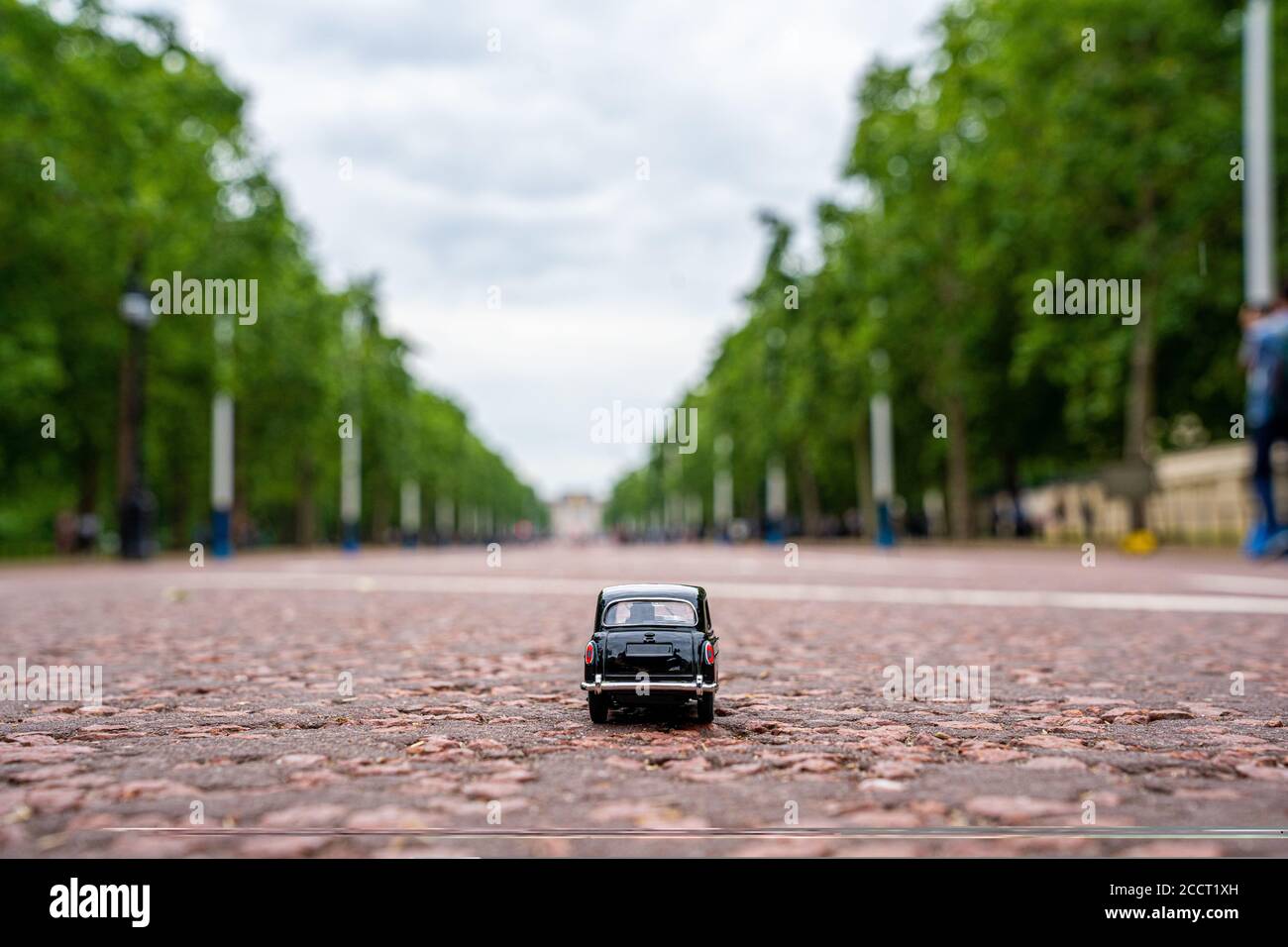 Closeup shot of a traditional black cab driving through the most famous ...