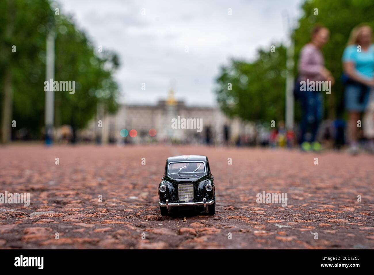 Closeup shot of a traditional black cab driving through the most famous ...