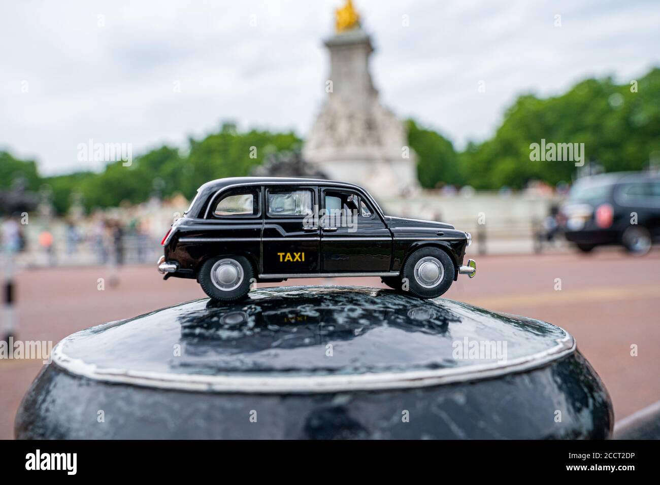 Closeup shot of a traditional black cab driving through the most famous ...