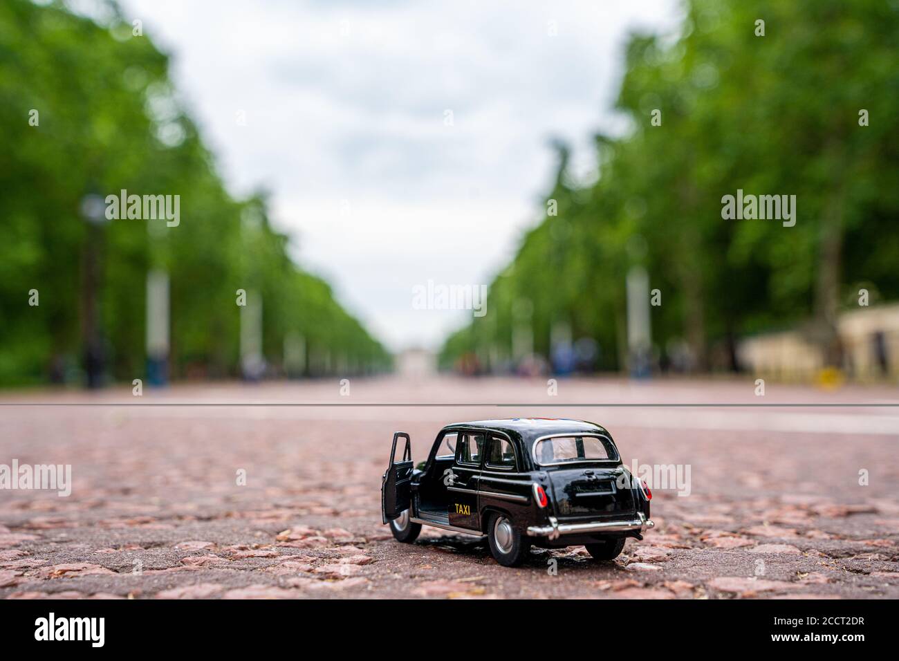 Closeup shot of a traditional black cab driving through the most famous ...