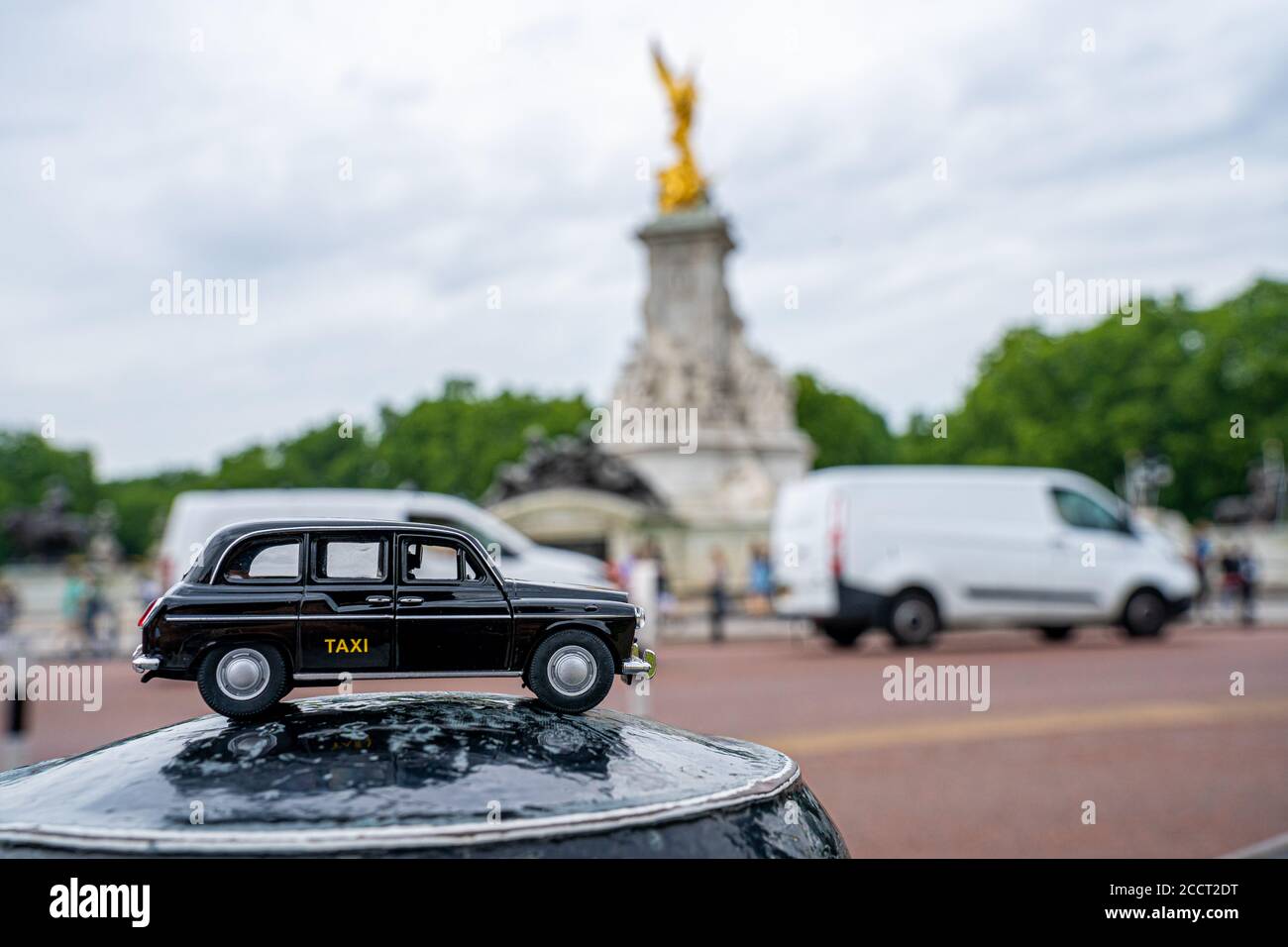 Closeup shot of a traditional black cab driving through the most famous ...