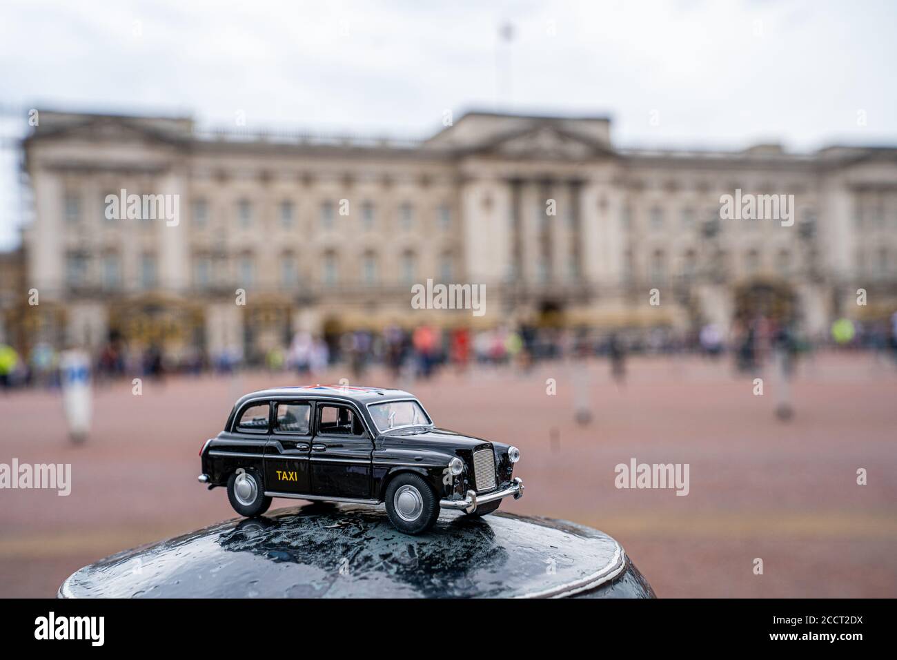Closeup shot of a traditional black cab driving through the most famous ...