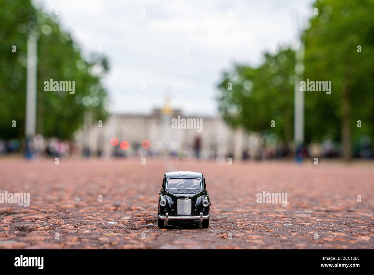 Closeup shot of a traditional black cab driving through the most famous ...