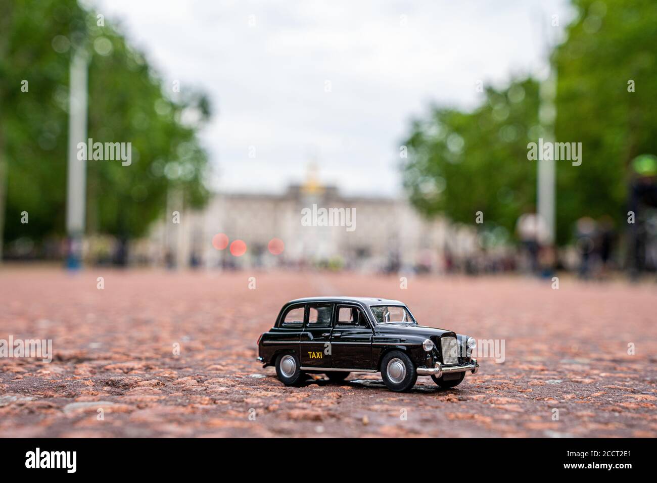 Closeup shot of a traditional black cab driving through the most famous ...