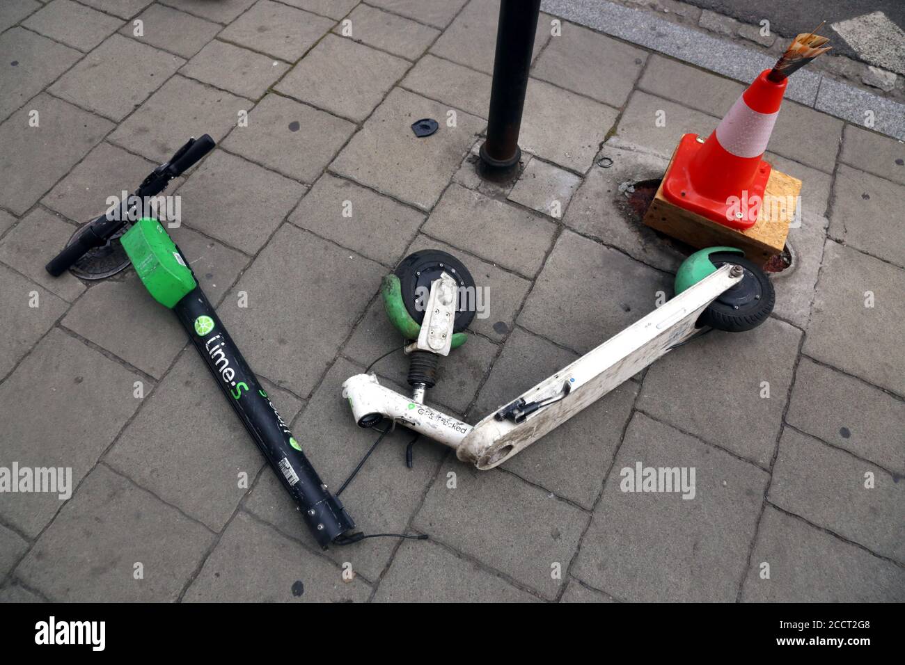 Cracow. Krakow. Poland.Damaged e-scooter tossed on the sidewalk with ...