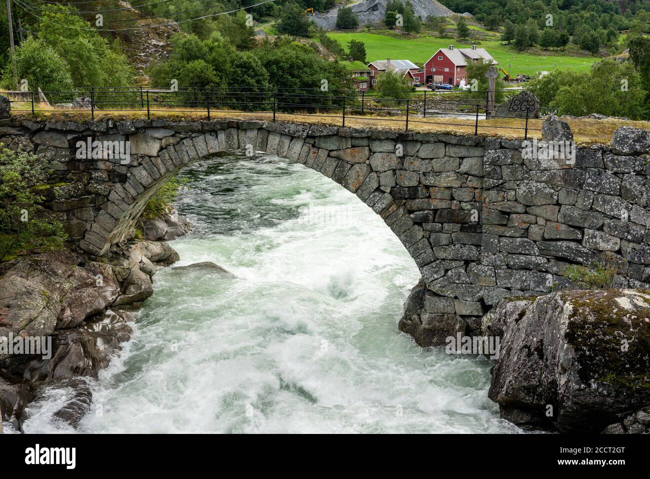 Disused old bridge at Sletthagen crossing the Laerdalselva River as it ...