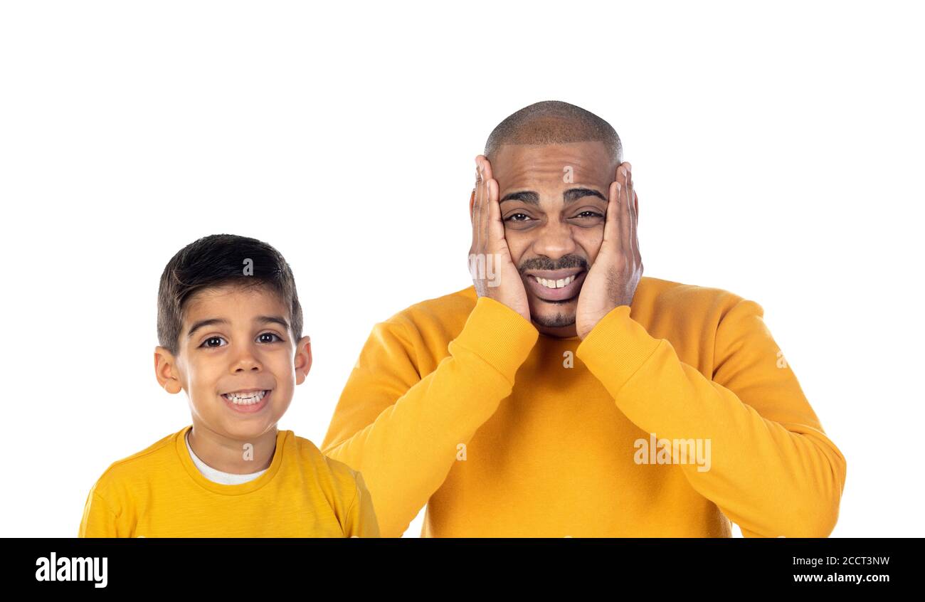 Father and son wearing yellow clothes isolated on a white background ...