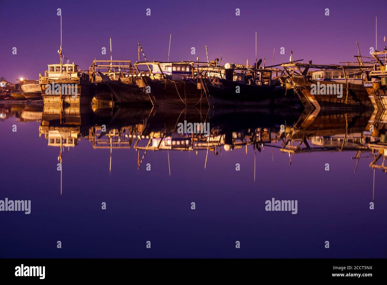 Boats during the night in a port Stock Photo - Alamy