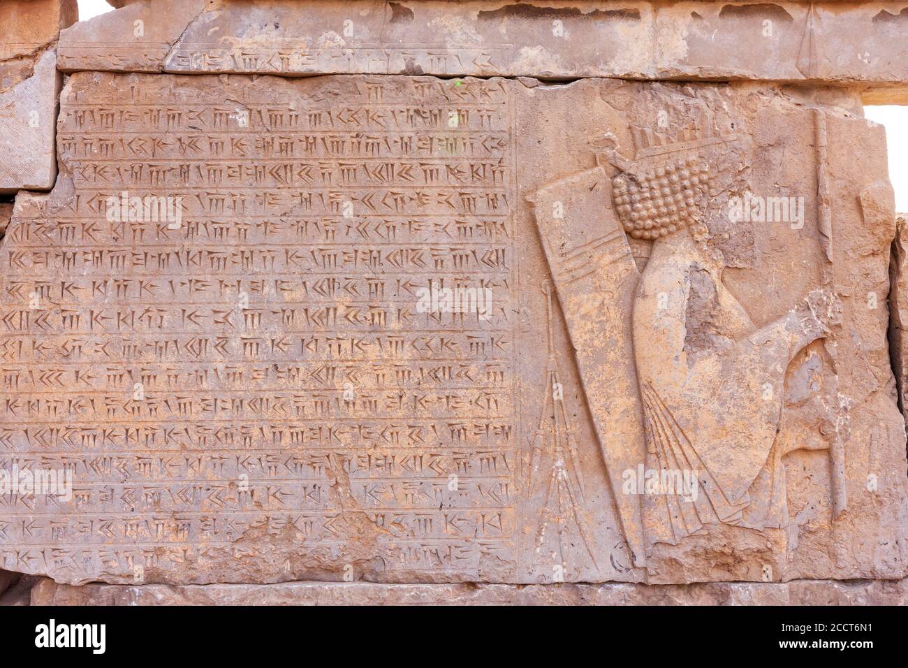 Old Persian cuneiform next to an immortal persian soldier mural in ...