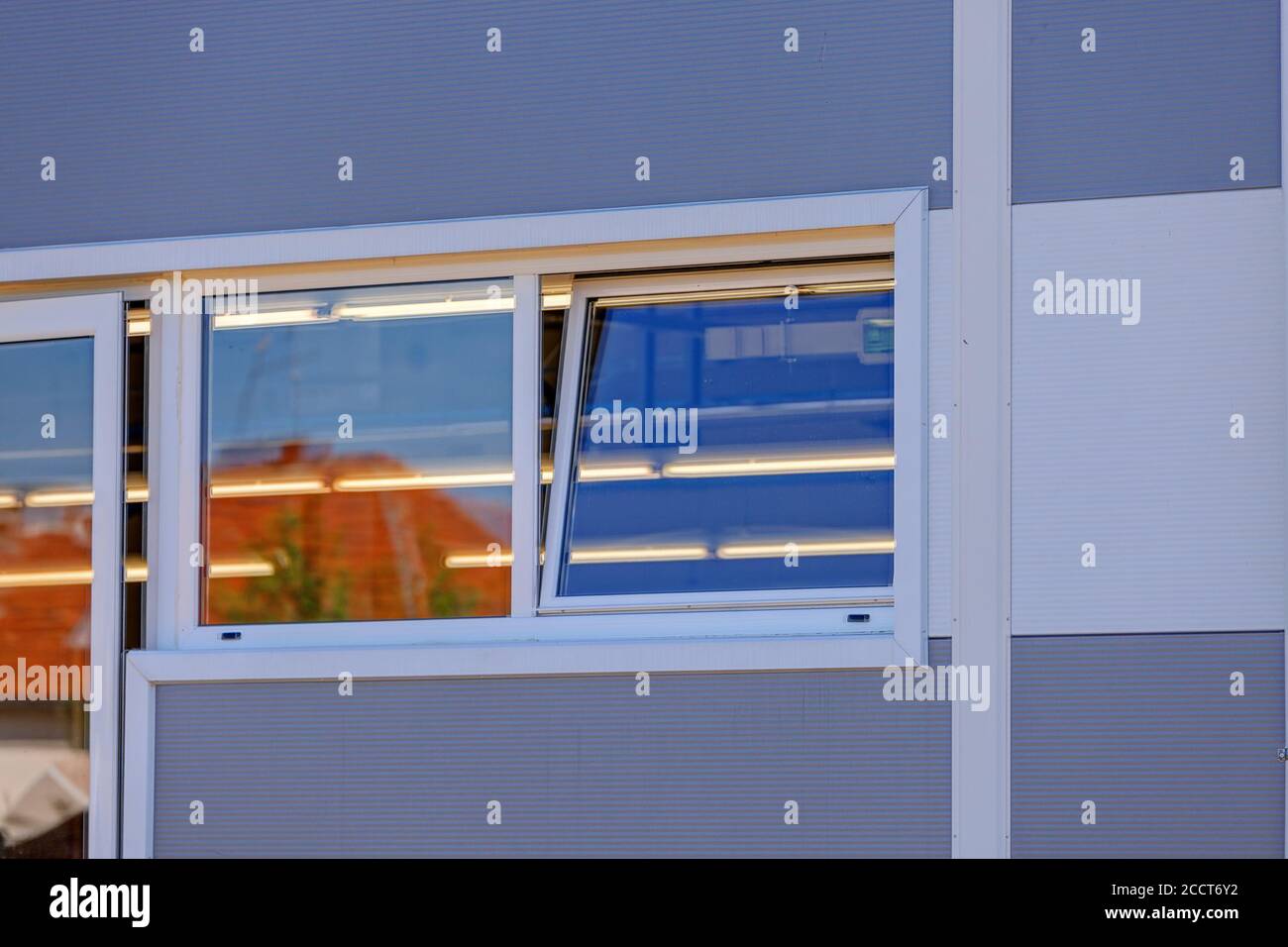 industrial building with blue windows Stock Photo - Alamy