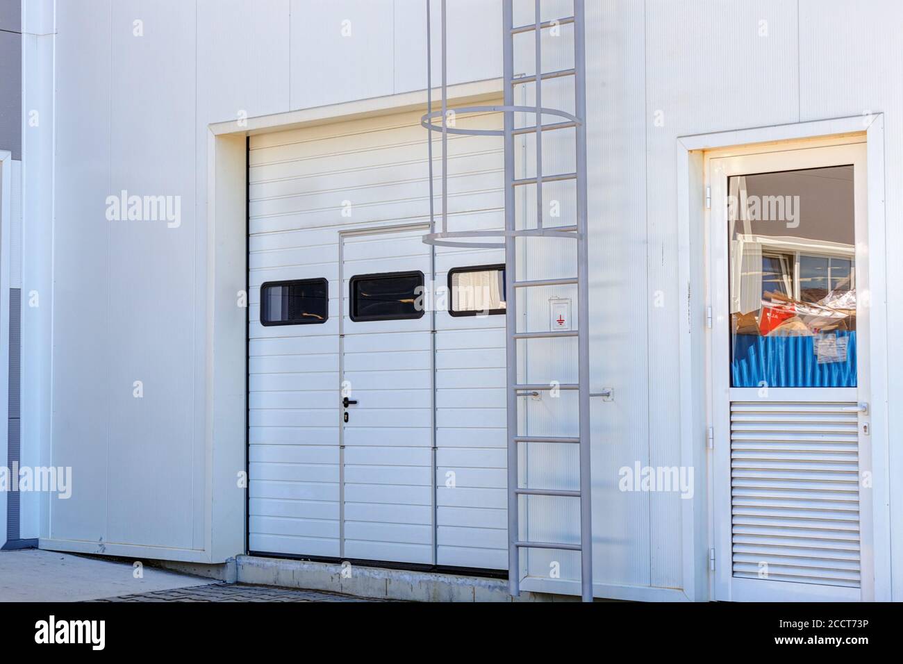 doors for loading goods at the industrial building Stock Photo - Alamy