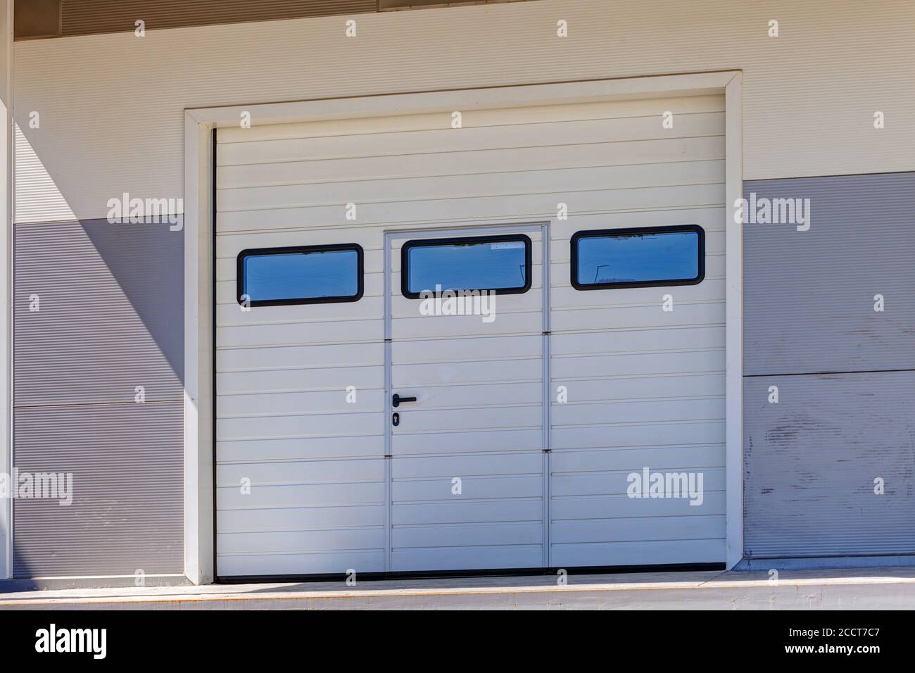 doors for loading goods at the industrial building Stock Photo - Alamy