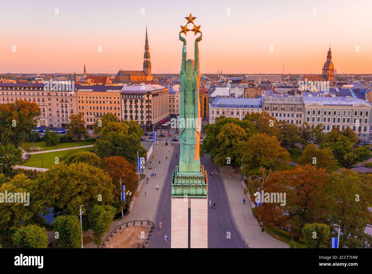 Freedom Monument surrounded by buildings and trees under the sunlight ...