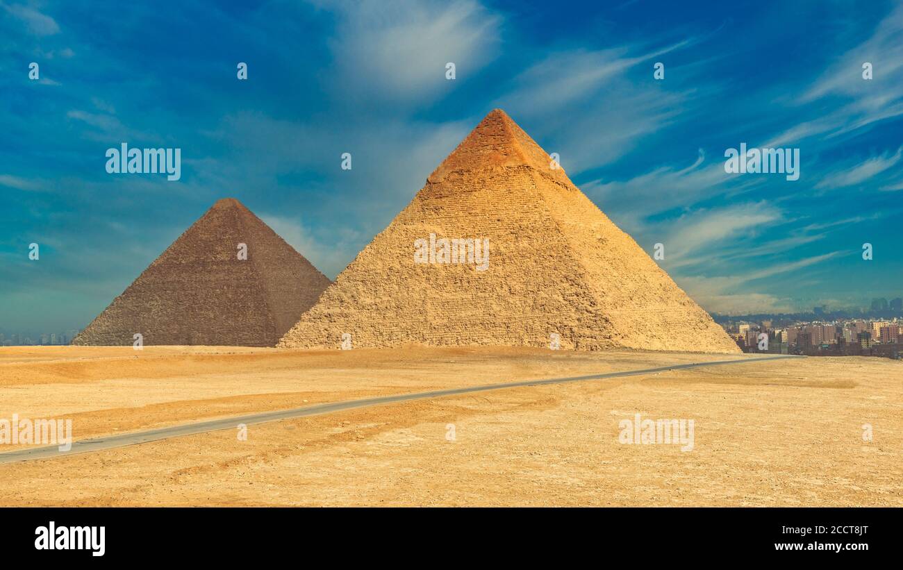 The famous pyramids at Giza in Egypt with a blue sky Stock Photo - Alamy