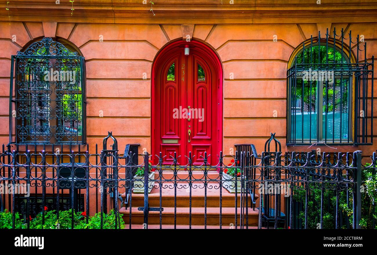New York City, USA, May 2019, red front entrance door in the Chelsea ...