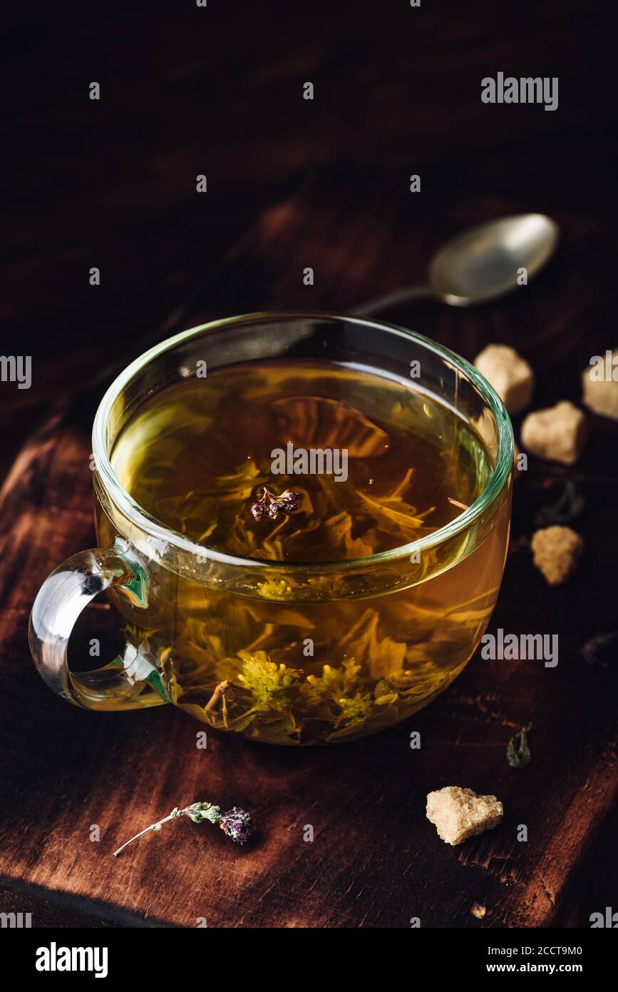 Cup of green tea with brown tea sugar Stock Photo - Alamy