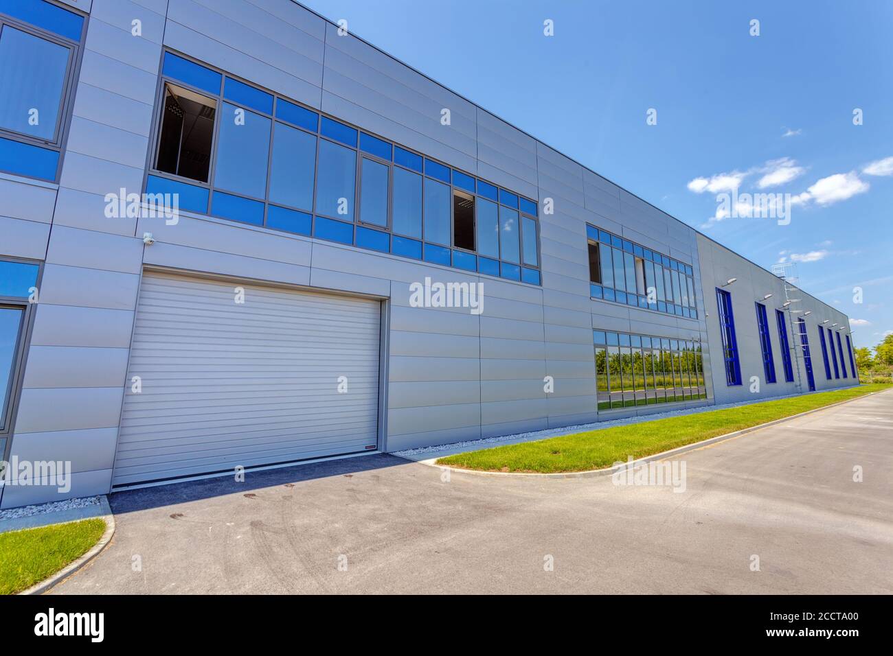 industrial building with blue windows Stock Photo - Alamy