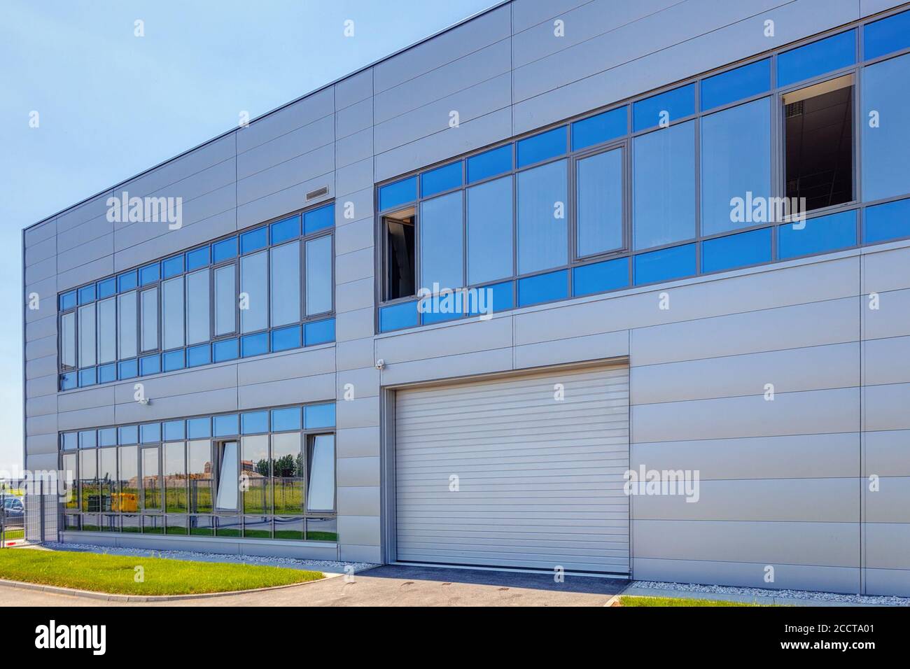 industrial building with blue windows Stock Photo - Alamy