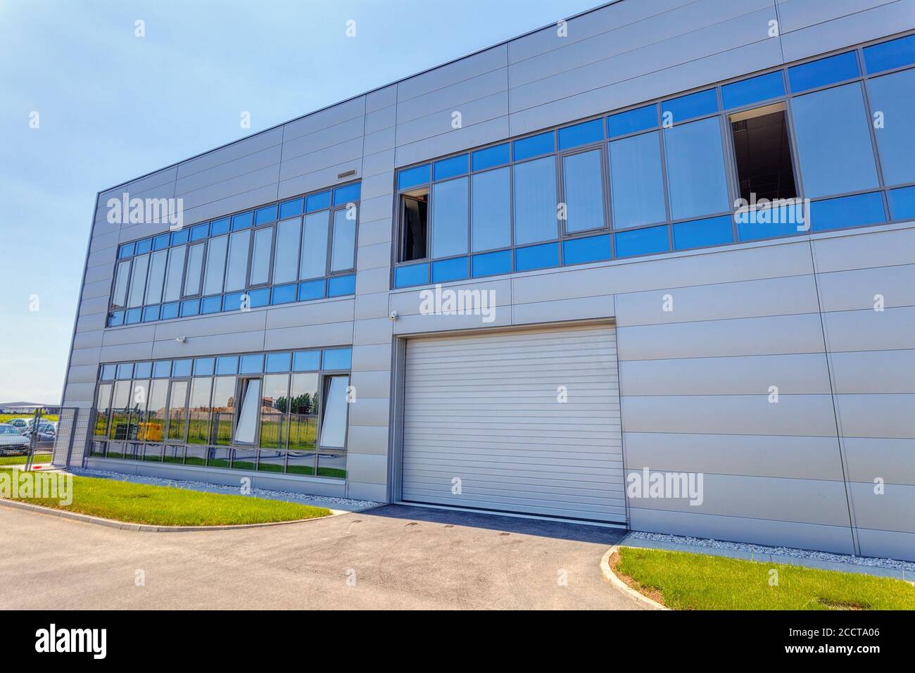 industrial building with blue windows Stock Photo - Alamy