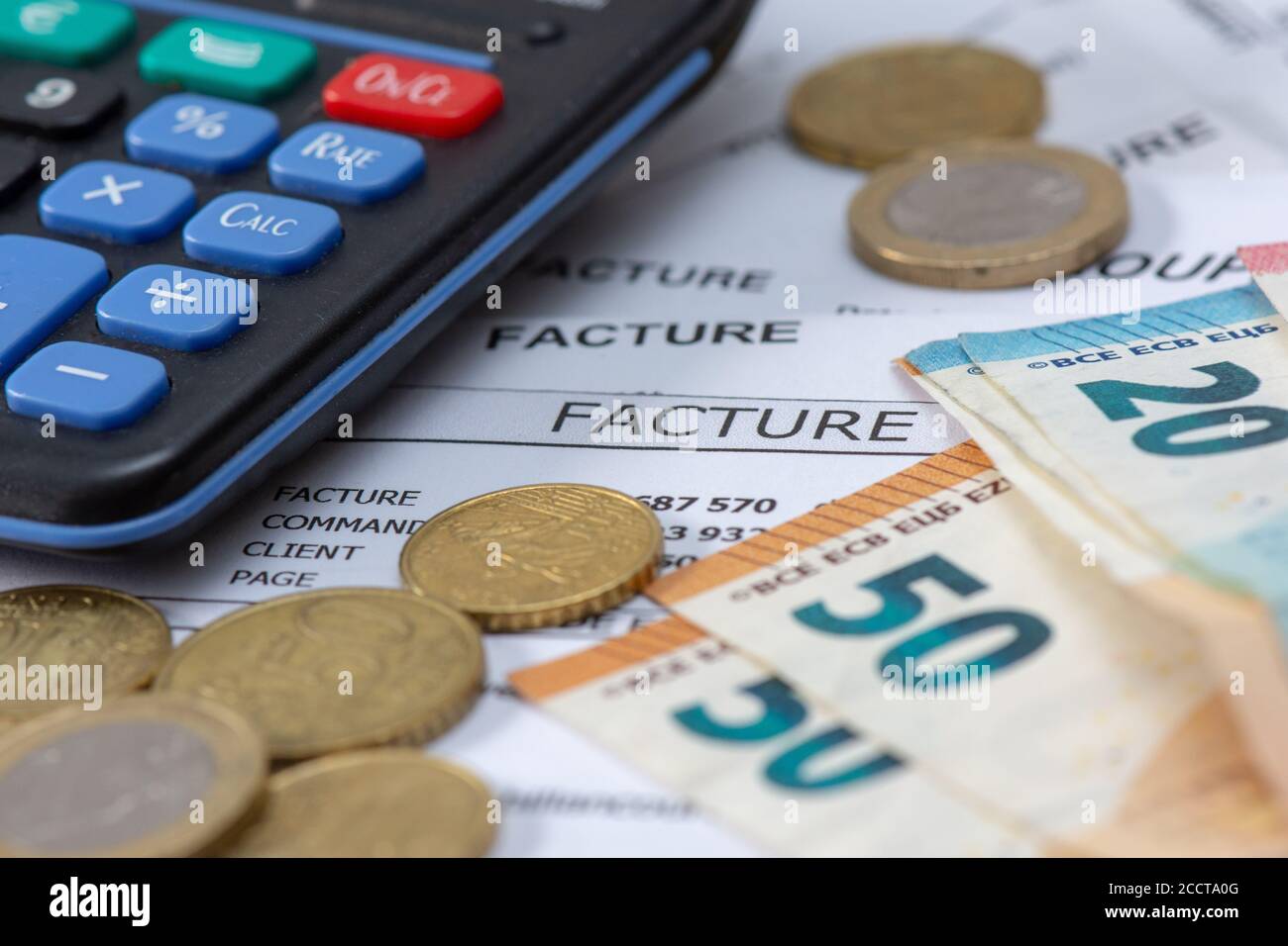 French invoices ("facture") with euro cash and a calculator Stock Photo ...