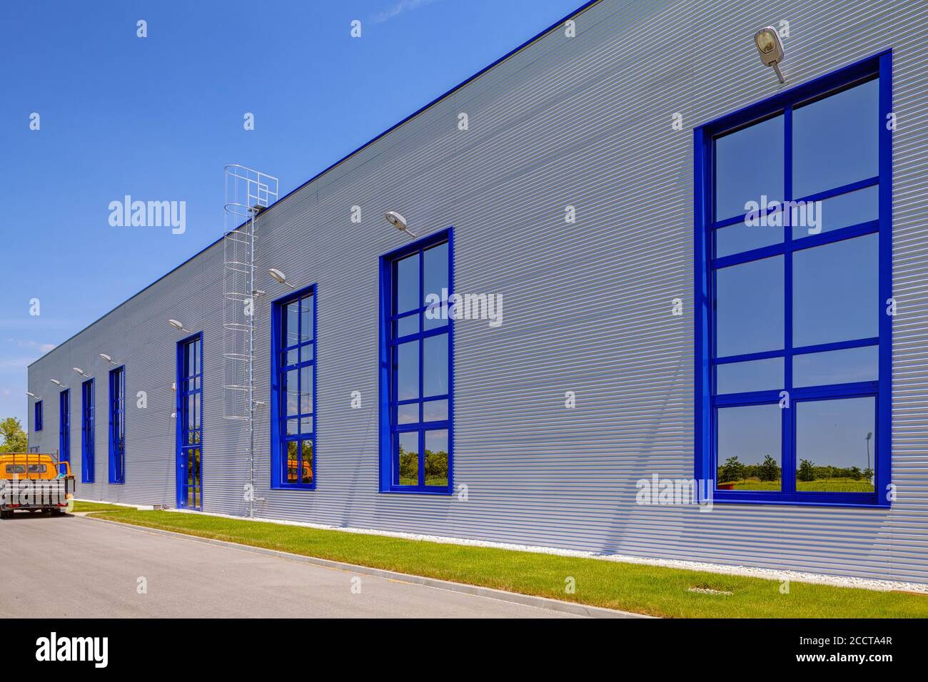 industrial building with blue windows Stock Photo - Alamy