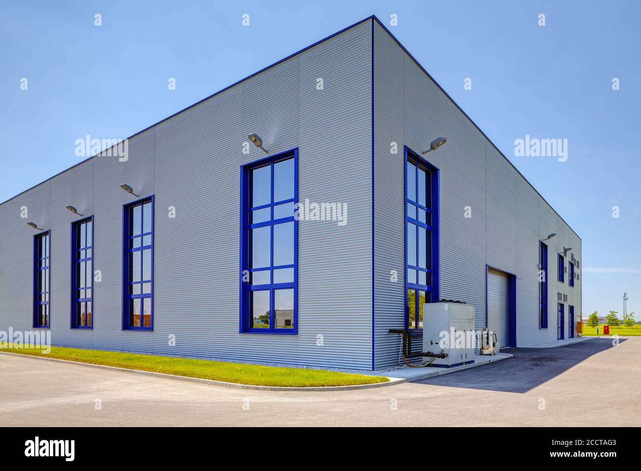 industrial building with blue windows Stock Photo - Alamy