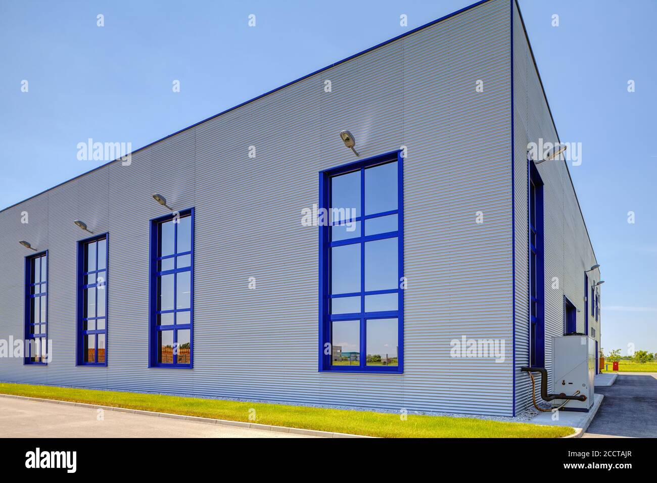 industrial building with blue windows Stock Photo - Alamy