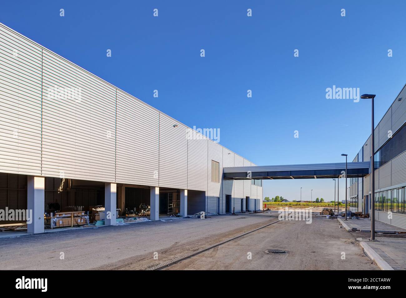 finishing work on building business industrial building Stock Photo - Alamy
