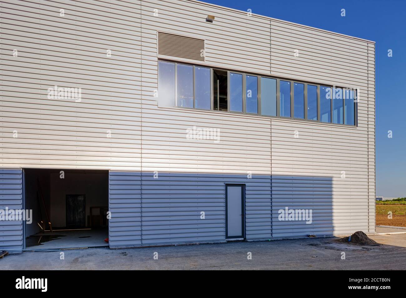 finishing work on building business industrial building Stock Photo - Alamy