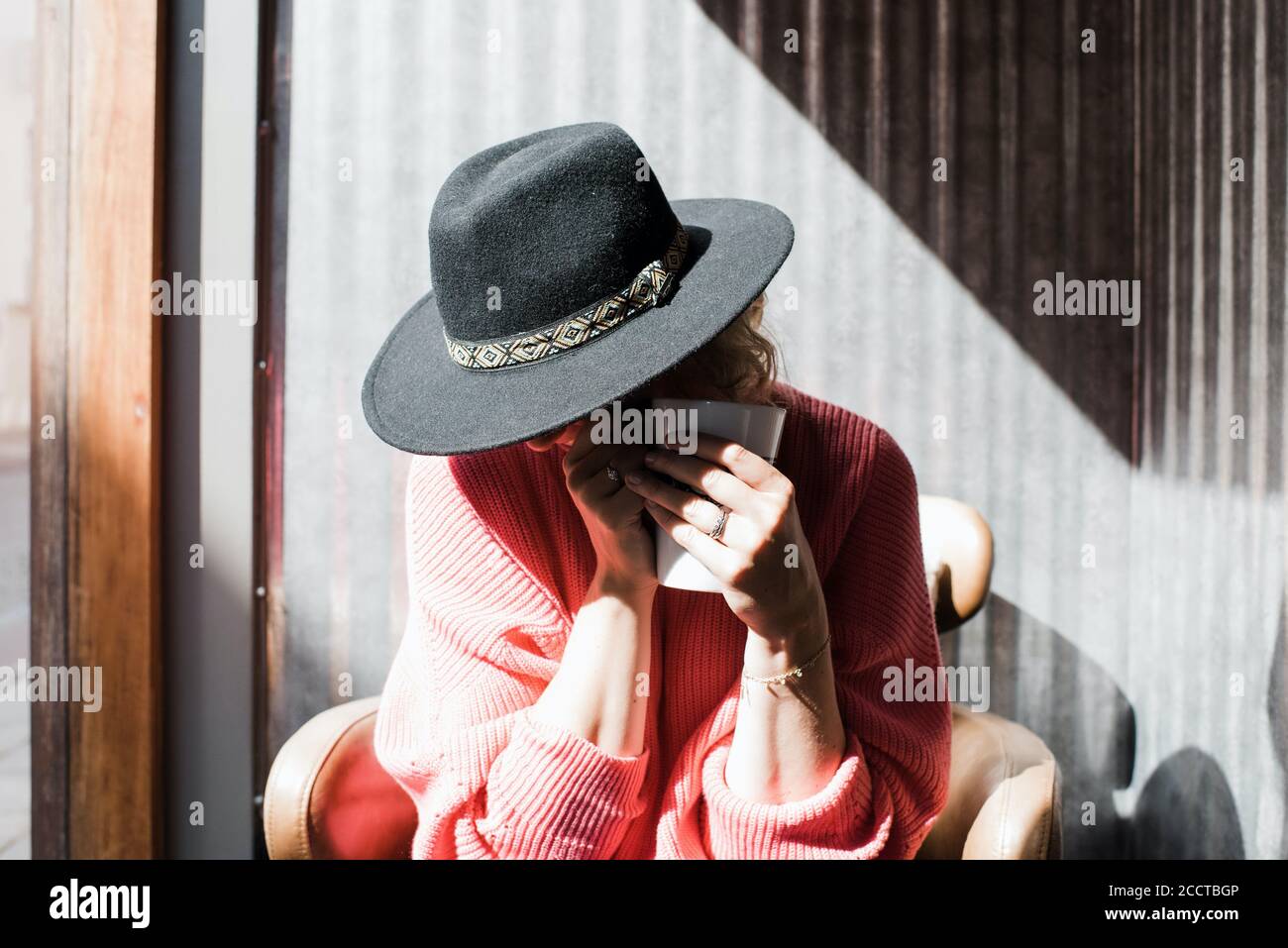 Hiding under hat hi-res stock photography and images - Alamy