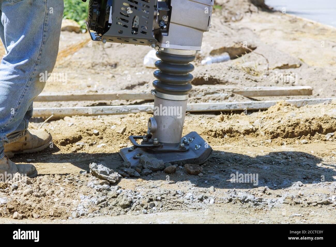 Jumping hammer vibratory on sand ground in construction process during ...
