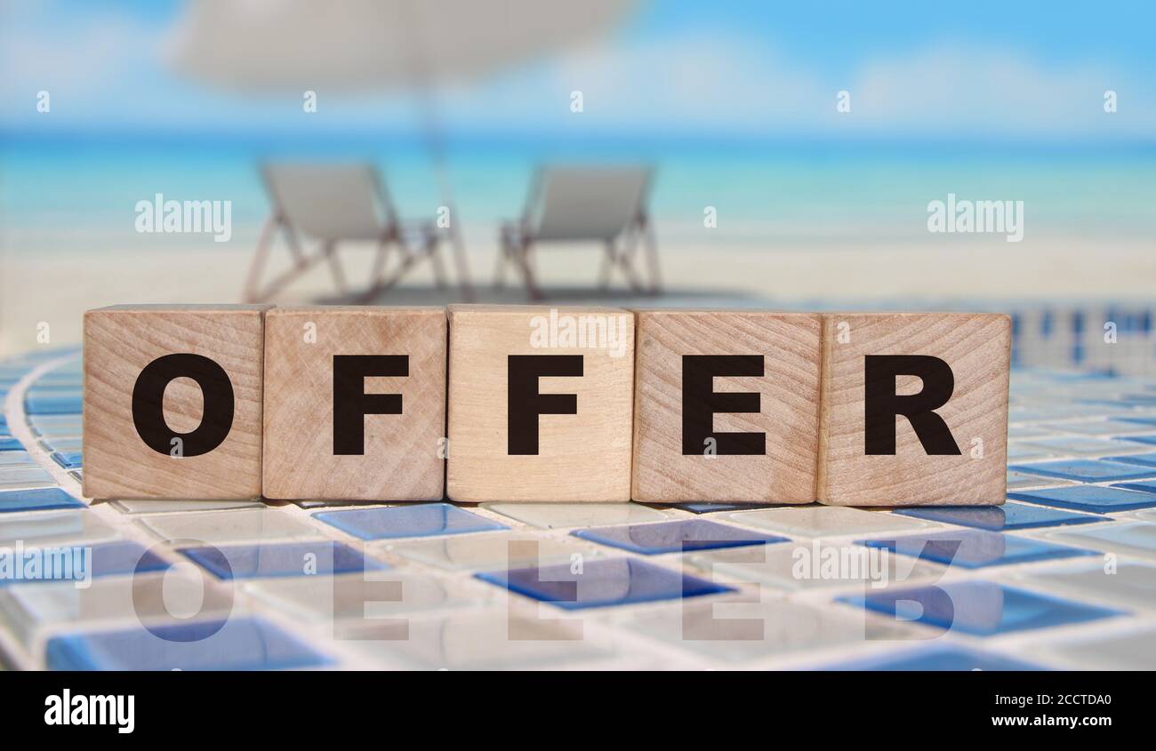Word OFFER on wooden blocks on swimming pool border. Business Concept ...