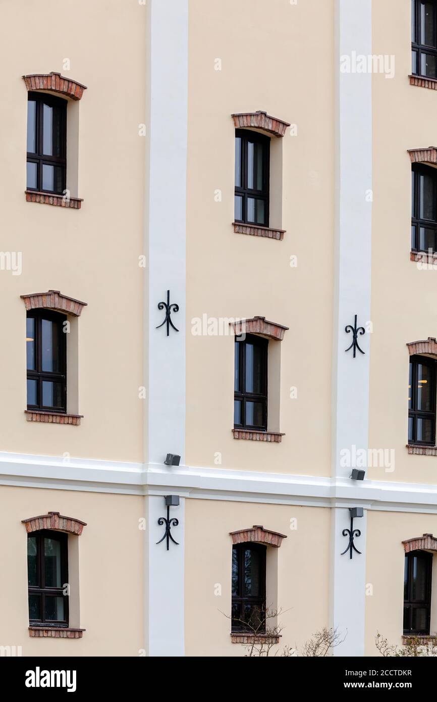 Restored building with antique windows Stock Photo - Alamy