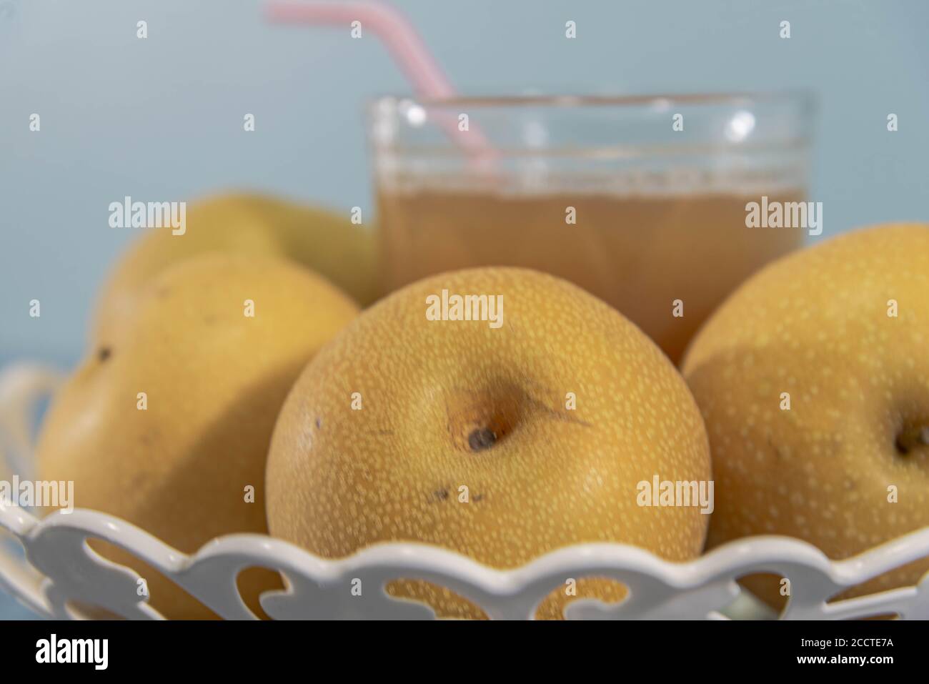 Fresh pear fruits. Blue background. Natural fruits. Refreshing drink ...