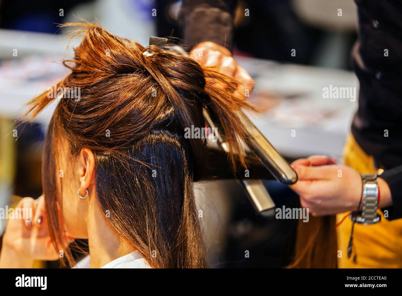 modern hairstyles with the help of electric Styler Stock Photo - Alamy