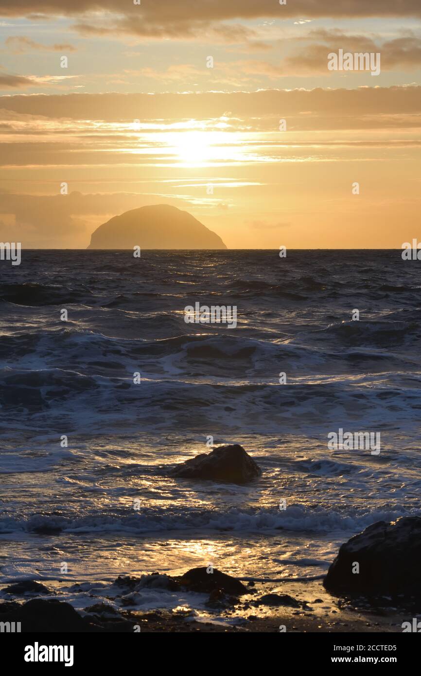 Sunset over Ailsa Craig on the Firth of Clyde, Ayrshire on a summer ...