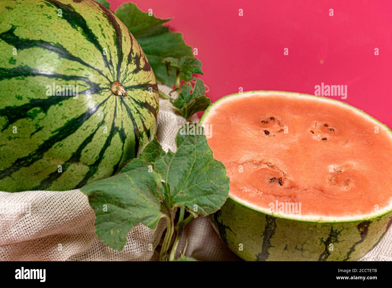 Fruit in halves of watermelon (Citrullus lanatus). Watermelon is ...