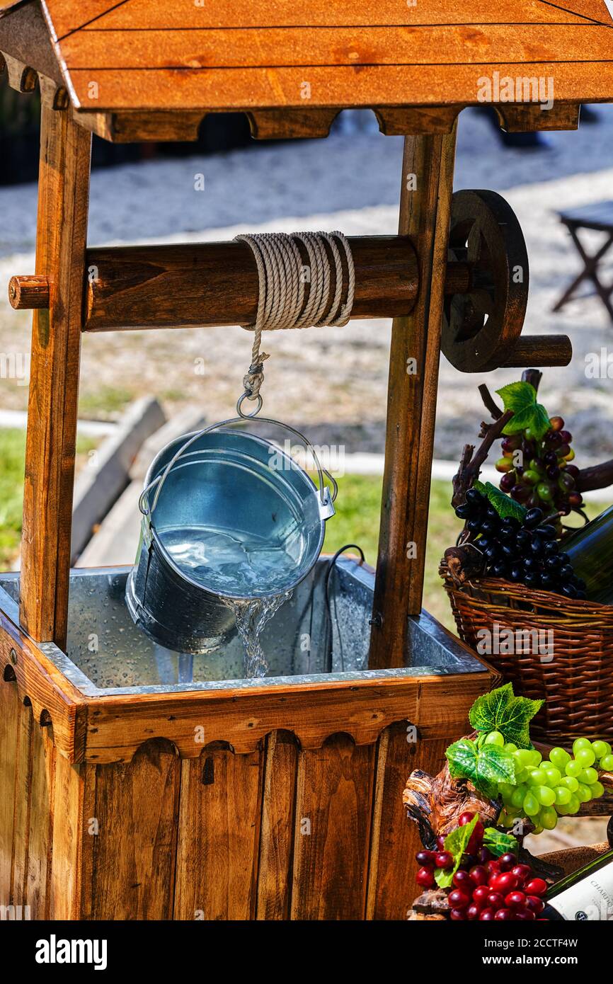 extracting water from wells with the help of bucket Stock Photo - Alamy