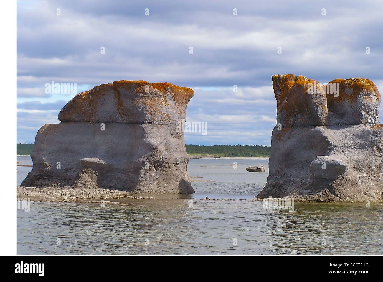 Monoliths on a cloudy sky in Mingan Archipelago, National Park Reserve ...