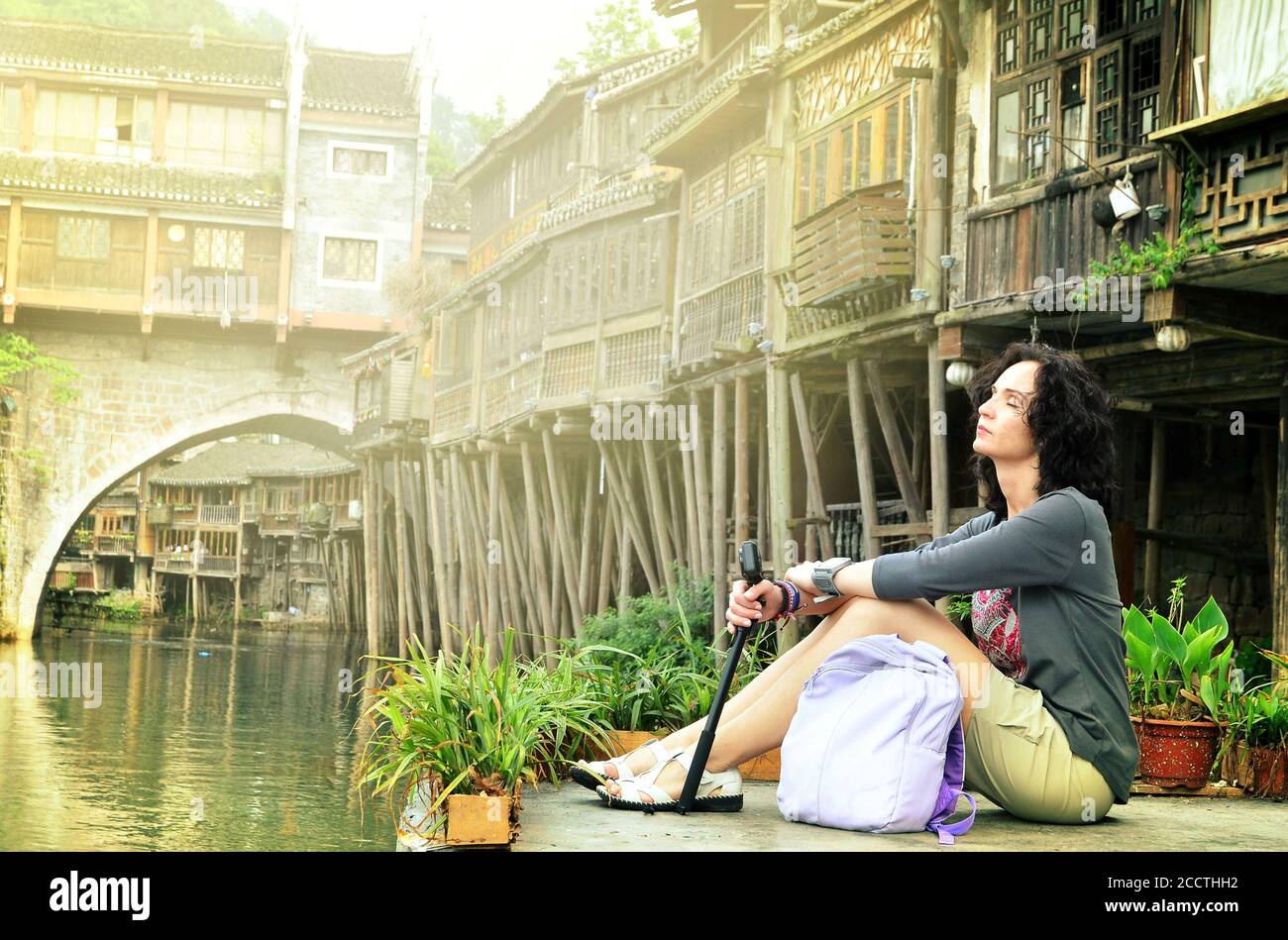 Women at riverside on the Phoenix Hong Bridge in Fenghuang Stock Photo ...