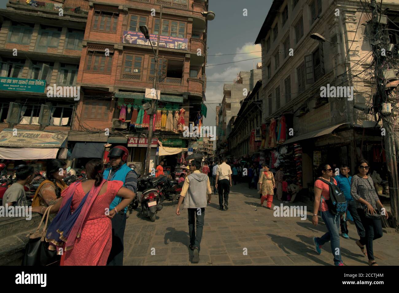 People walking through a shopping area in Thamel, Kathmandu, Nepal ...