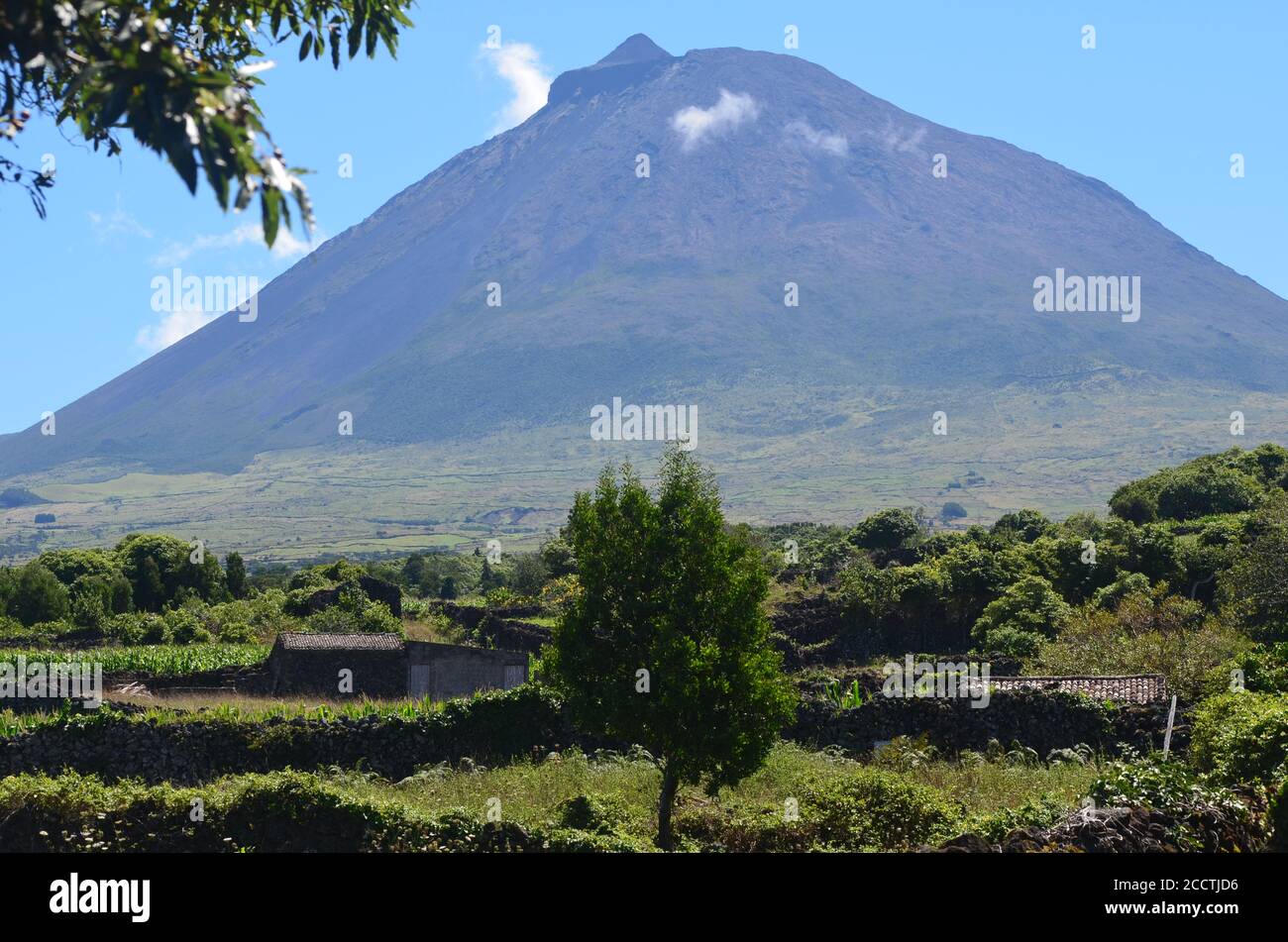 The conical Pico volcano looming over its namesake island (Azores ...